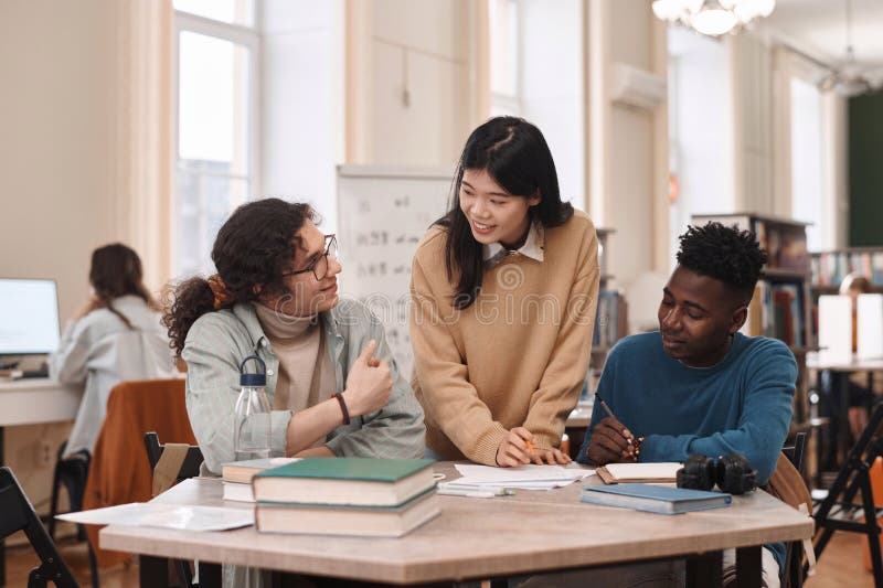Three Students Studying in Library Stock Image - Image of university ...