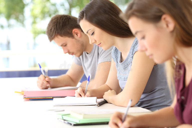 Three Students Taking Notes during a Class Stock Photo - Image of ...