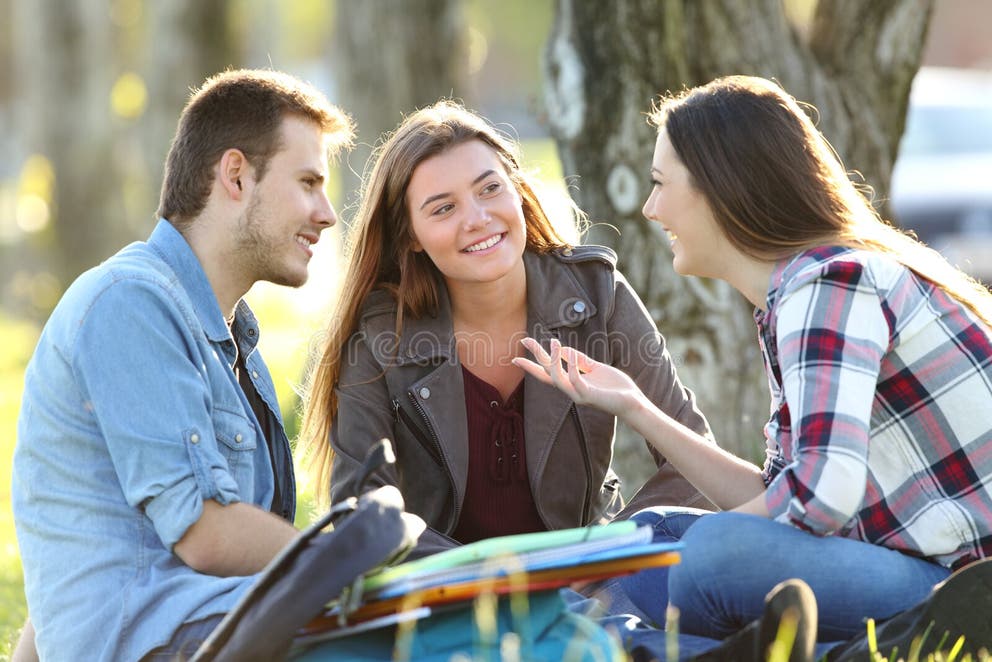 Three Students Talking after Class Stock Image - Image of campus ...