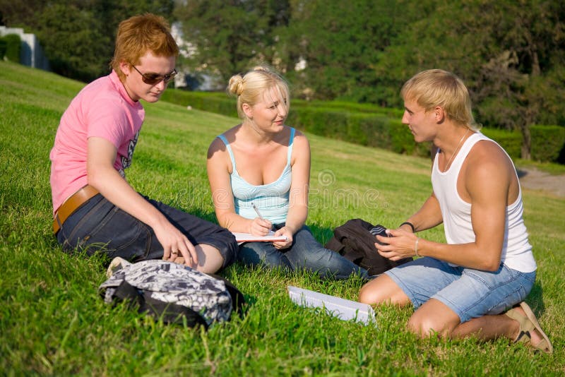 Three Students Talking in the Park Stock Image - Image of purple, bags ...