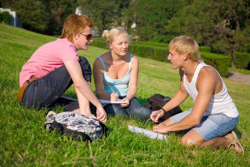 Three Students Talking in the Park Stock Photo - Image of beautiful ...