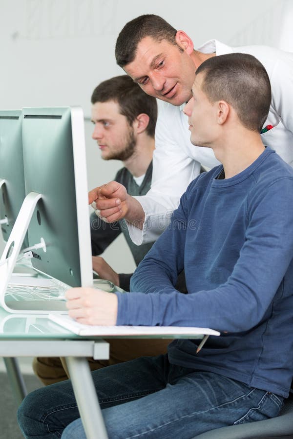 Three Students in Technology Class Stock Photo - Image of classroom ...
