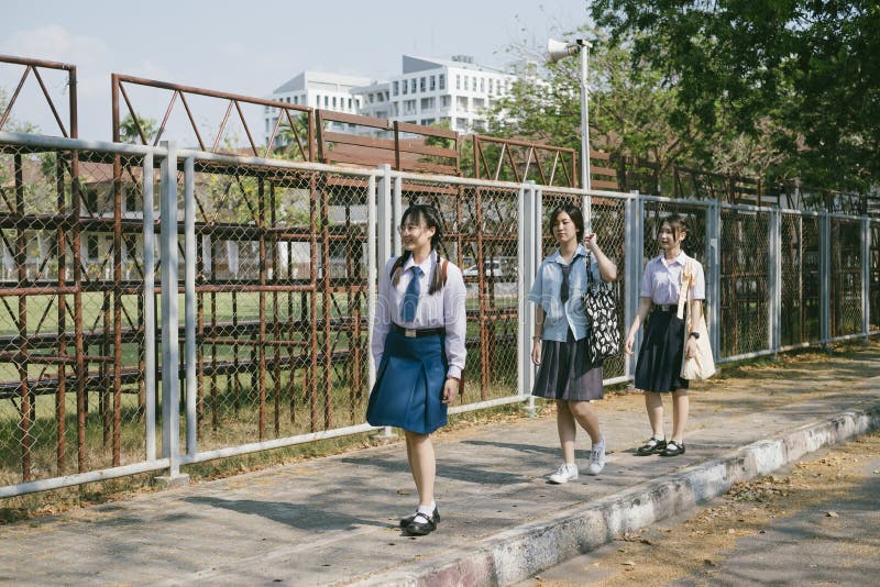 Three Students Walking Home Together Stock Image - Image of group ...