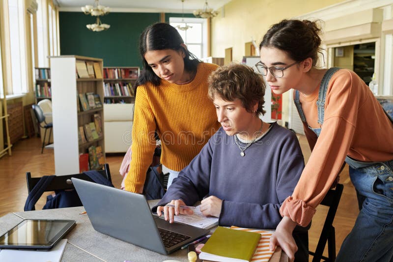 Three Students Collaborating on Shared Project in Library Stock Image ...