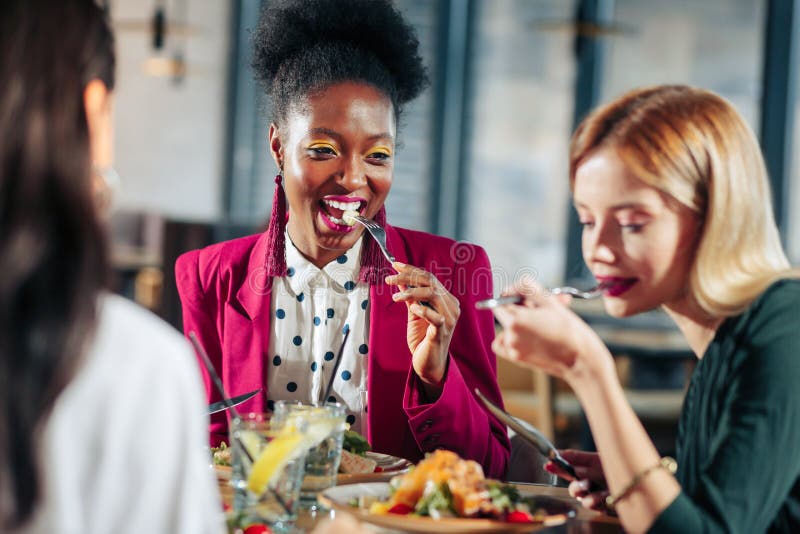 Three Stylish Appealing Women Having Delicious Dinner Together Stock ...