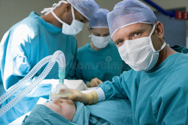 Doctors operating patient stock photo. Image of color - 18076956