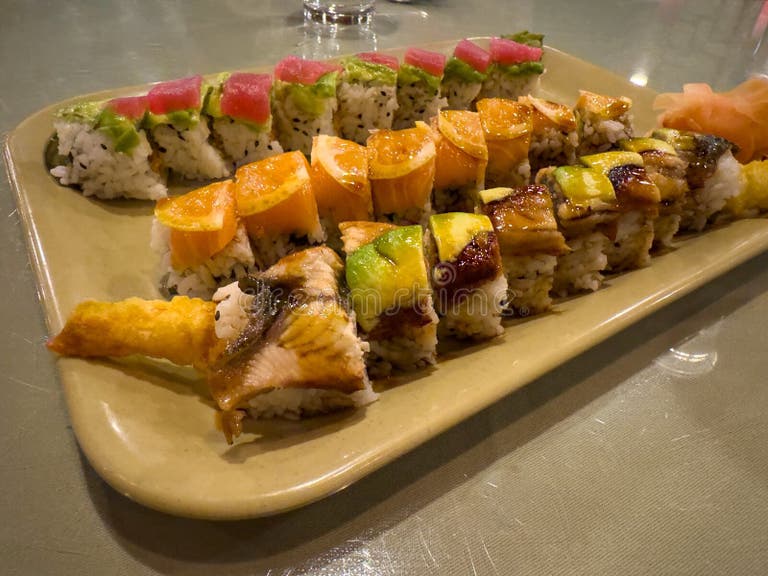Three Sushi Rolls on a Serving Plate in a Restaurant Stock Photo ...