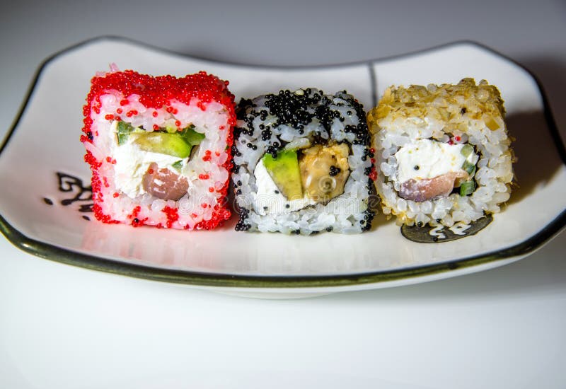 Three Sushi on a White Plate Stock Image - Image of vegetable ...