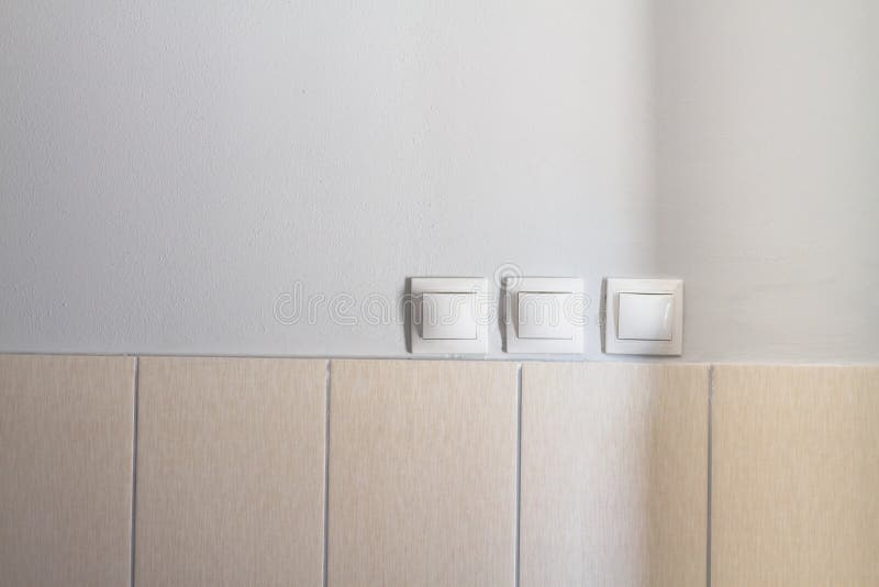 Three Switches for Turning on and Off the Lighting on the Wall Stock ...