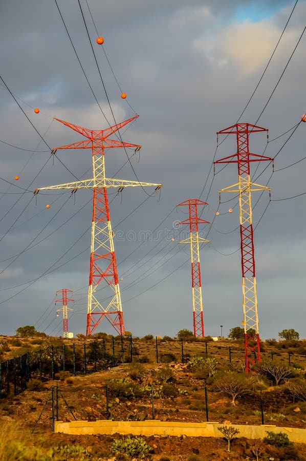 Three Tall Power Lines with Red and White Poles Stock Image - Image of ...
