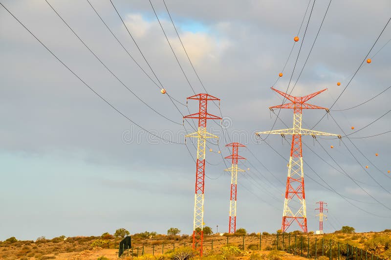 Three Tall Red and White Power Lines are in the Sky Stock Image - Image ...