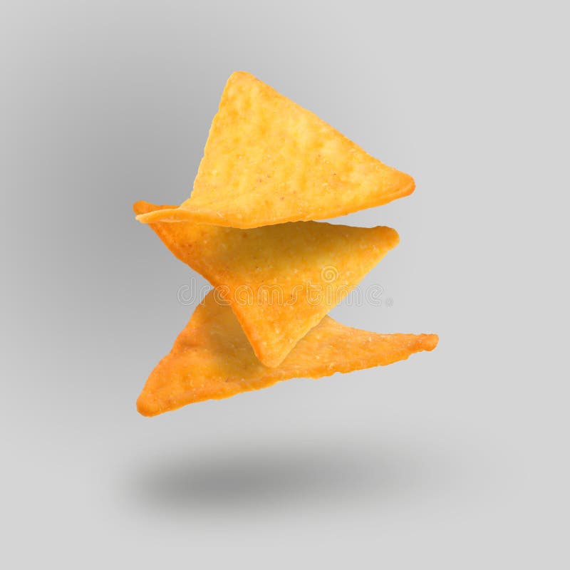 Three Tasty Tortilla Chips Falling on Grey Background Stock Image ...