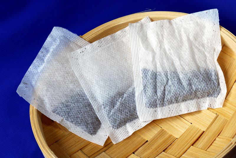 Three Tea Bags on a Bamboo Container Stock Image - Image of close ...