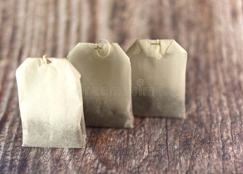 Three Tea Bags on Wooden Background Stock Image - Image of blend, paper ...