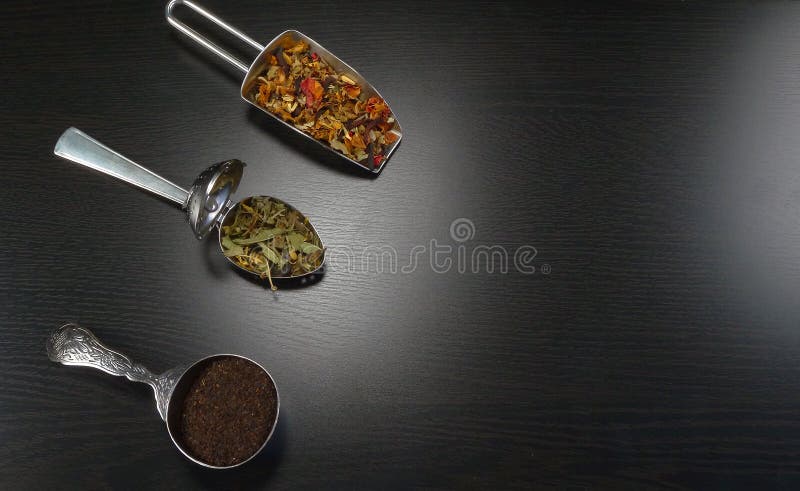 Three Tea Spoons with Real Tea on a Black Wooden Background Stock Image ...
