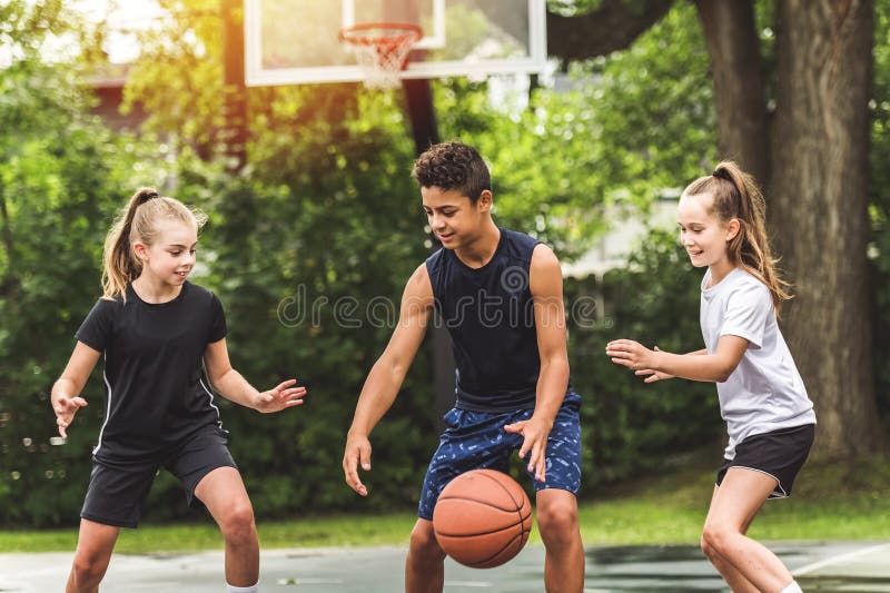Three Teens in Sportswear Playing Basketball Game Stock Image - Image ...