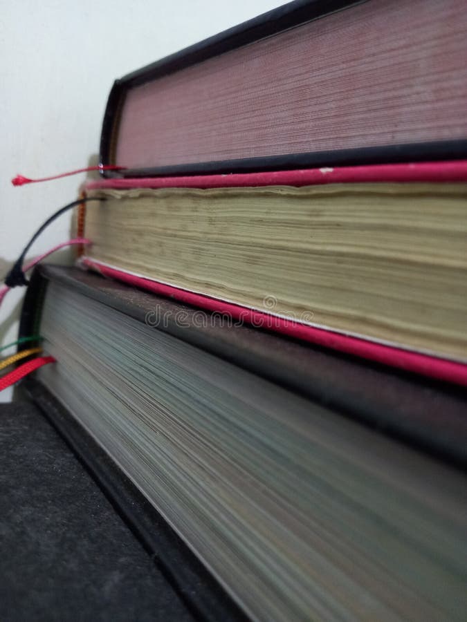 Three Thick and Dusty Books Piled Up in the Library Stock Photo - Image ...