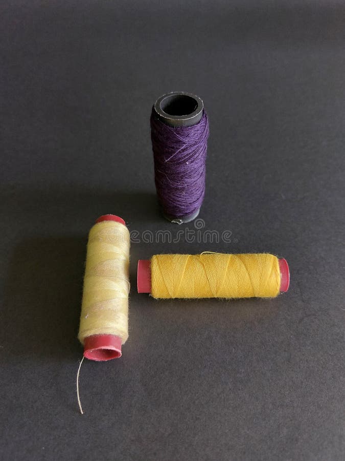 Three Threads of Various Colors, Yellow Purple and Cream Stock Image ...