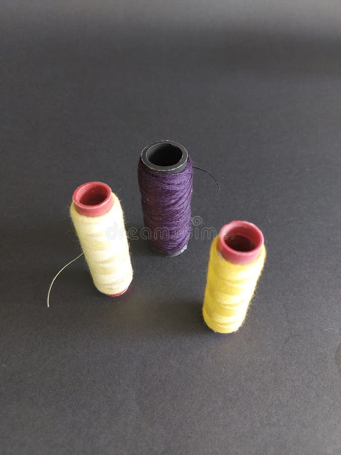 Three Threads of Various Colors, Yellow Purple and Cream Stock Photo ...