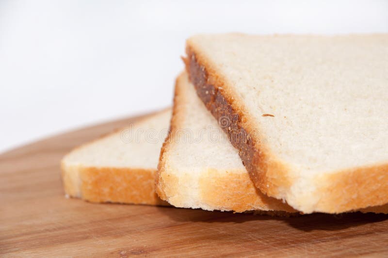 Three Toast Bread Pieces on the Wooden Board Stock Image - Image of ...