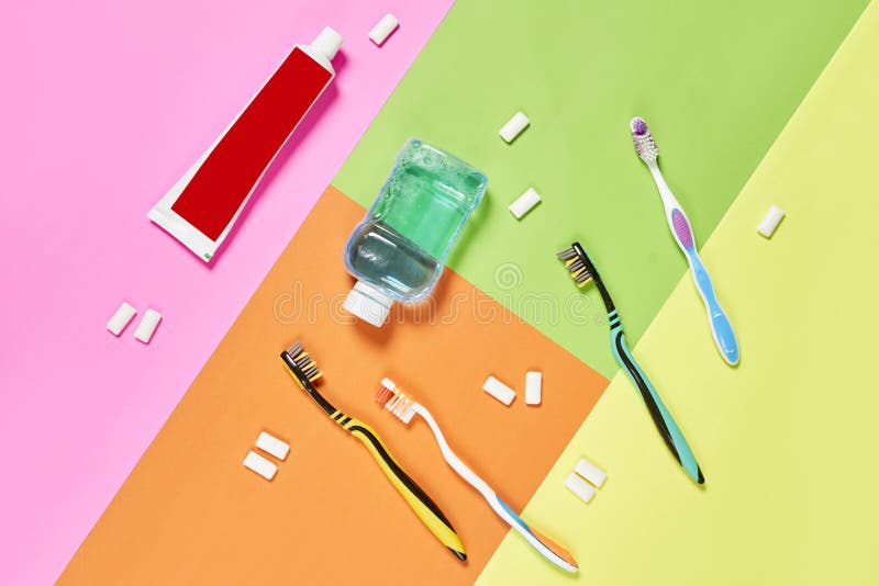 Three Toothbrushes and a Jar of Toothpaste Stock Image - Image of ...