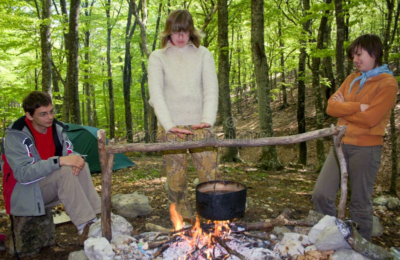 Team of Climbers Man and Woman Hiker Camping.they are Sitting Around ...