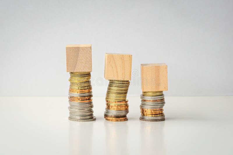 Three Toy Blocks on Top of Stacked Coins Stock Photo - Image of charge ...