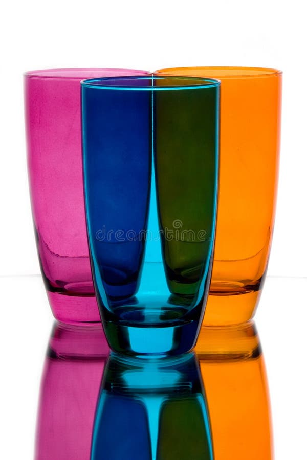 Three Translucent Colored Glasses Illuminated and Reflecting Light ...