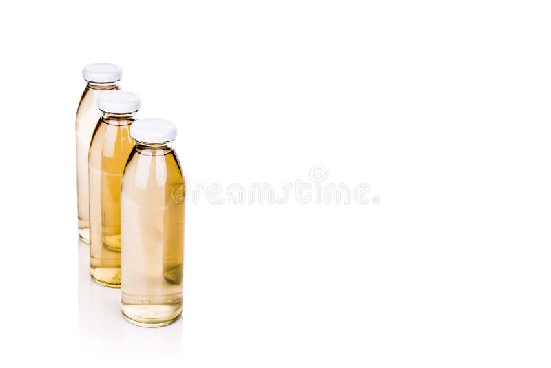 Three Translucent Liquid in Glass Bottle on White Background Stock ...