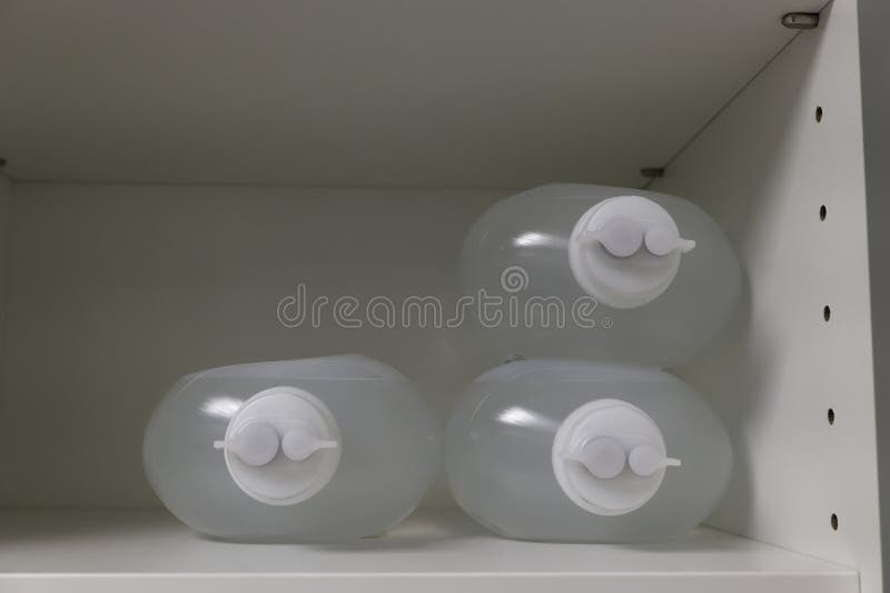 Three Transparent Plastic Containers with NACL for Injection Stock ...