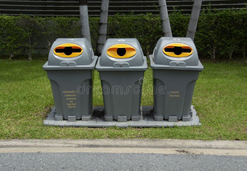 Three Trash Bins are Located on the Grass in the Garden Stock Image ...