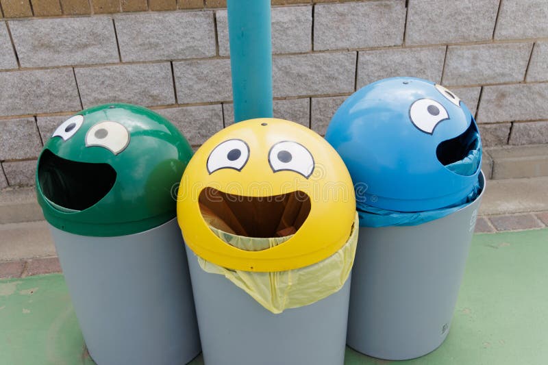 Three Trash Cans with Faces on Them Stock Photo - Image of container ...