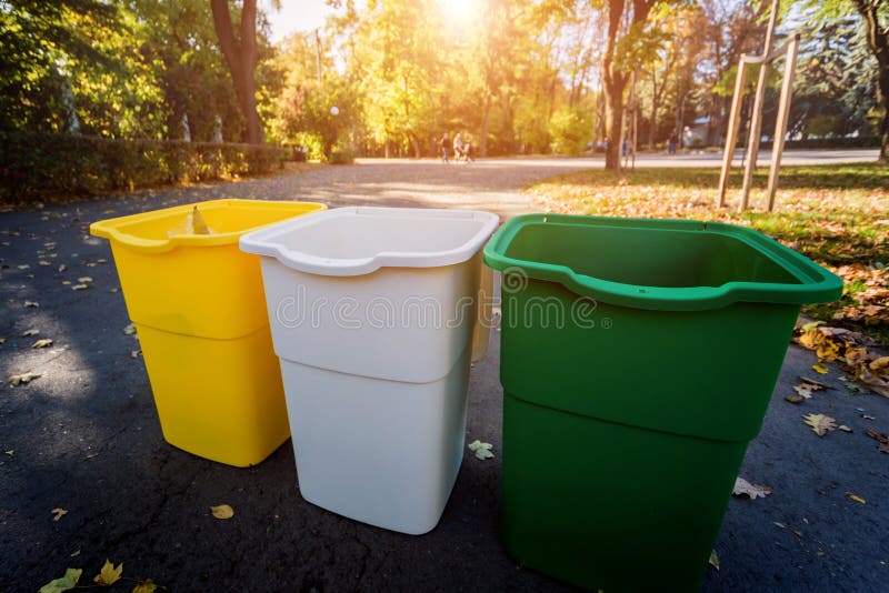 Three Trash Containers in Different Color, for Sorted Waste. Outdoors ...