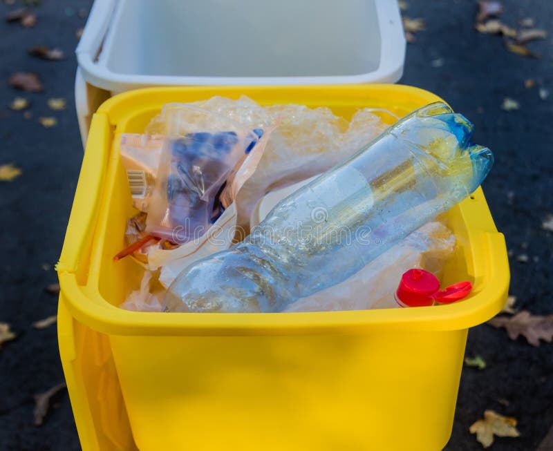 Three Trash Containers in Different Color, for Sorted Waste. Outdoors ...