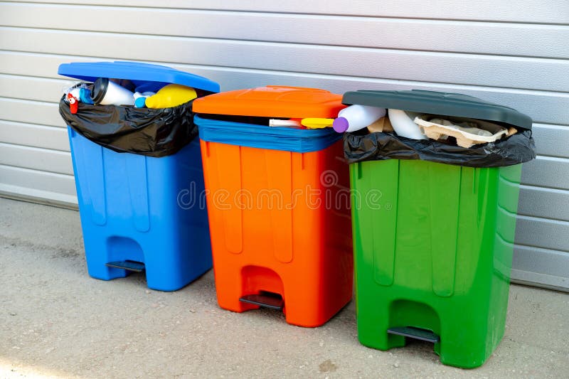 Three Trash Containers Full of Garbage Near the Building Stock Image ...