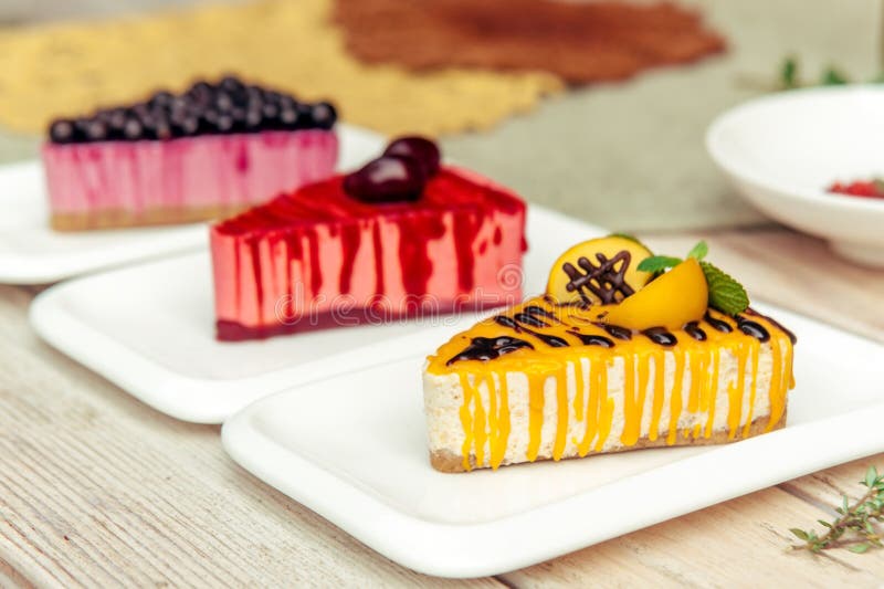 Three Triangular Creative Pieces of Cake with Apricot Plum and Currant ...