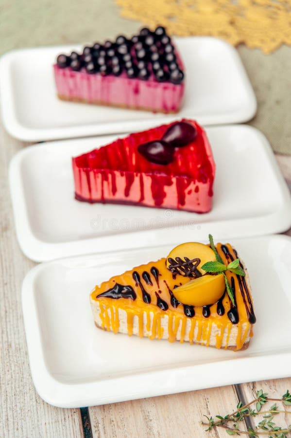 Three Triangular Creative Pieces of Cake with Apricot Plum and Currant ...