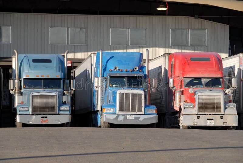 Three trucks at warehouse stock photo. Image of waiting - 4132638