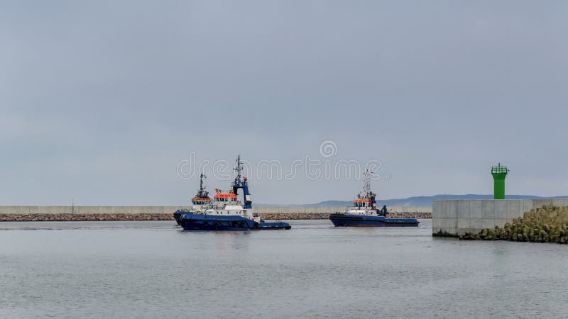 Three tugs stock photo. Image of beacon, docksn, shore - 92599412