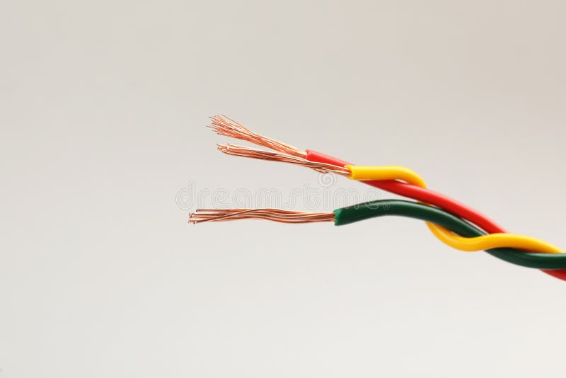Three Twisted Electrical Wires on Light Background, Closeup Stock Photo ...