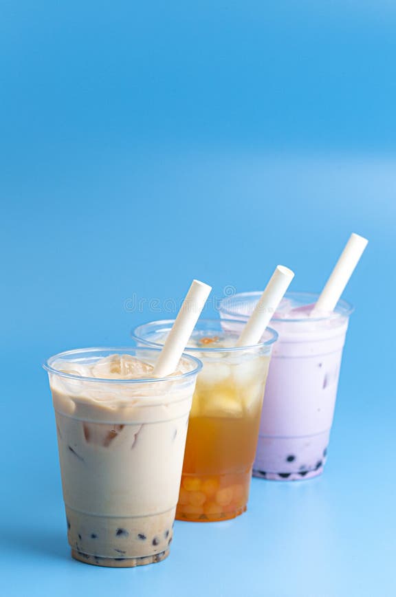 Three Different Types of Boba Tea on a Bright Blue Background Stock ...
