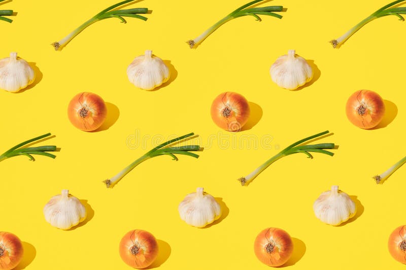 Three Types of Onions on a Yellow Background. Black, White and Spring ...