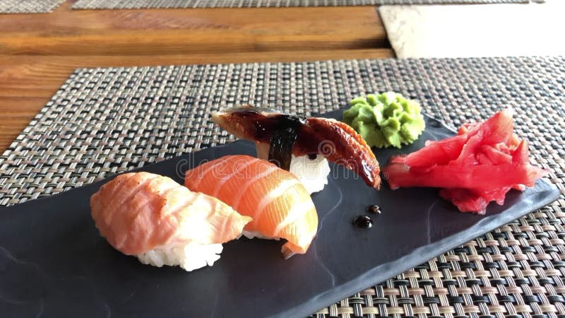 Three Types of Sushi with Fish on a Black Board Stock Footage - Video ...