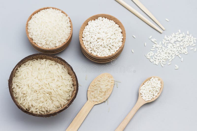 Three Types of White Rice in Wooden Bowls and Coconut Shells. Wooden ...