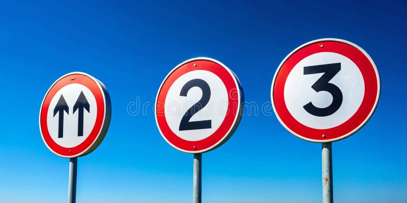 Three Unique Signs Framed Against a Clear Sky a Compositional ...