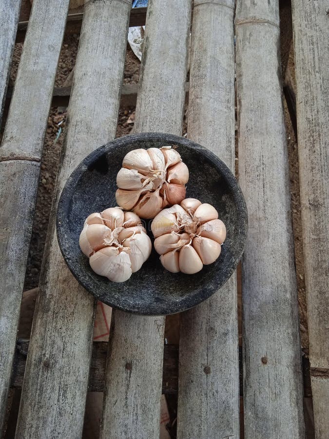 Three Unpelled Garlic in Stone Bowl Stock Image - Image of bowl, three ...