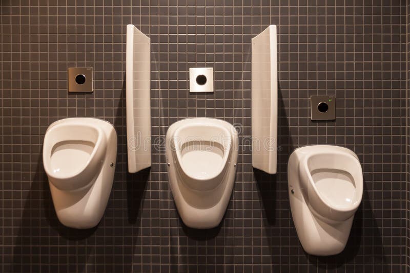 Three Urinals in a Bathroom Stock Photo - Image of urinal, public ...
