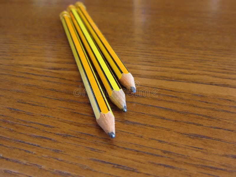 Three Used Pencils on Wooden Table Stock Photo - Image of eraser, worn ...