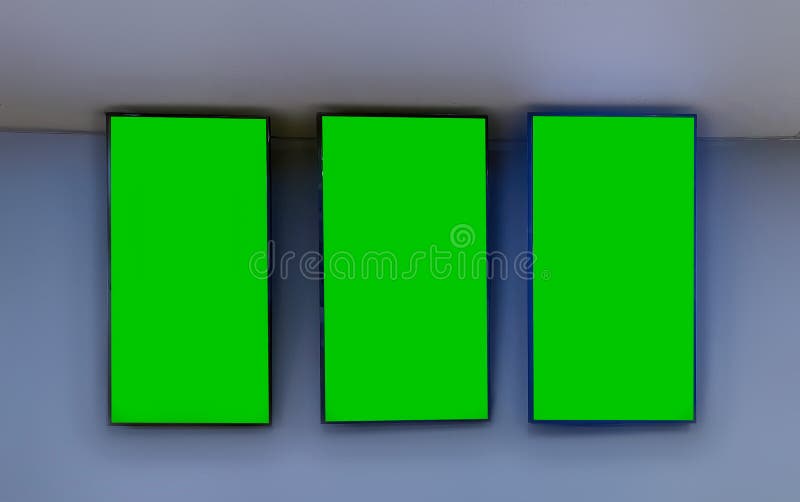 Three Vertical Green Screens Mounted on a Wall, Evenly Spaced, Offering ...