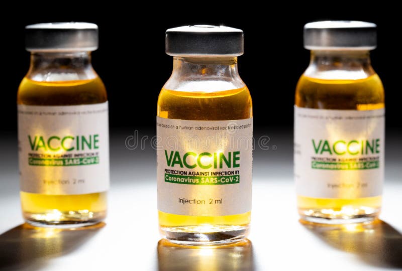 Three Vials with Coronavirus Vaccine on a Black Background and ...
